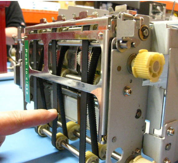 Instructions for tightening the rear belts on an F400 pick assembly ...